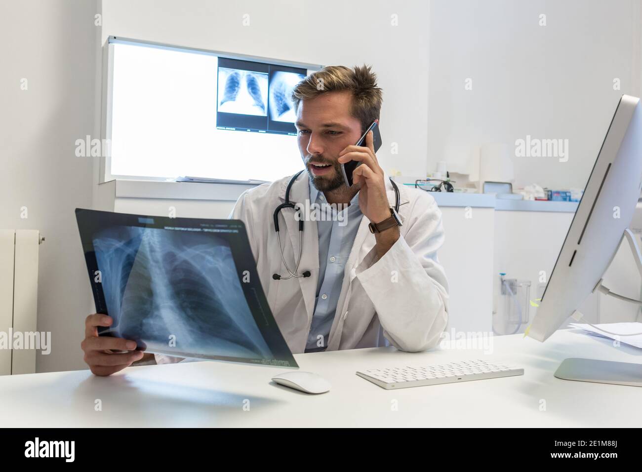 doctor examining an x-ray at hospital Stock Photo - Alamy