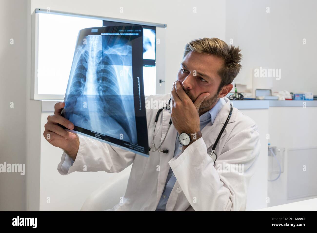 doctor examining an x-ray at hospital Stock Photo - Alamy