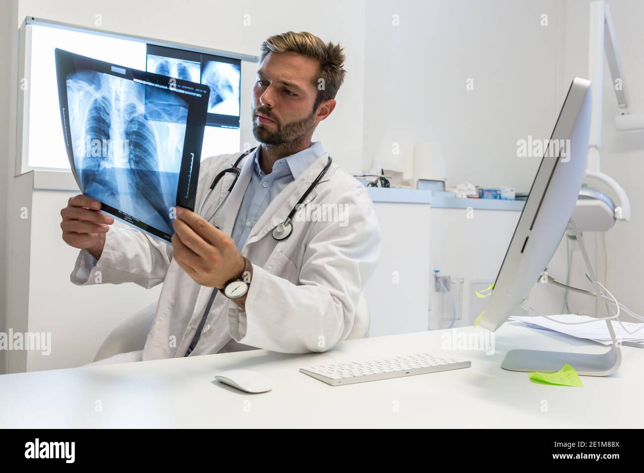 doctor examining an x-ray at hospital Stock Photo - Alamy