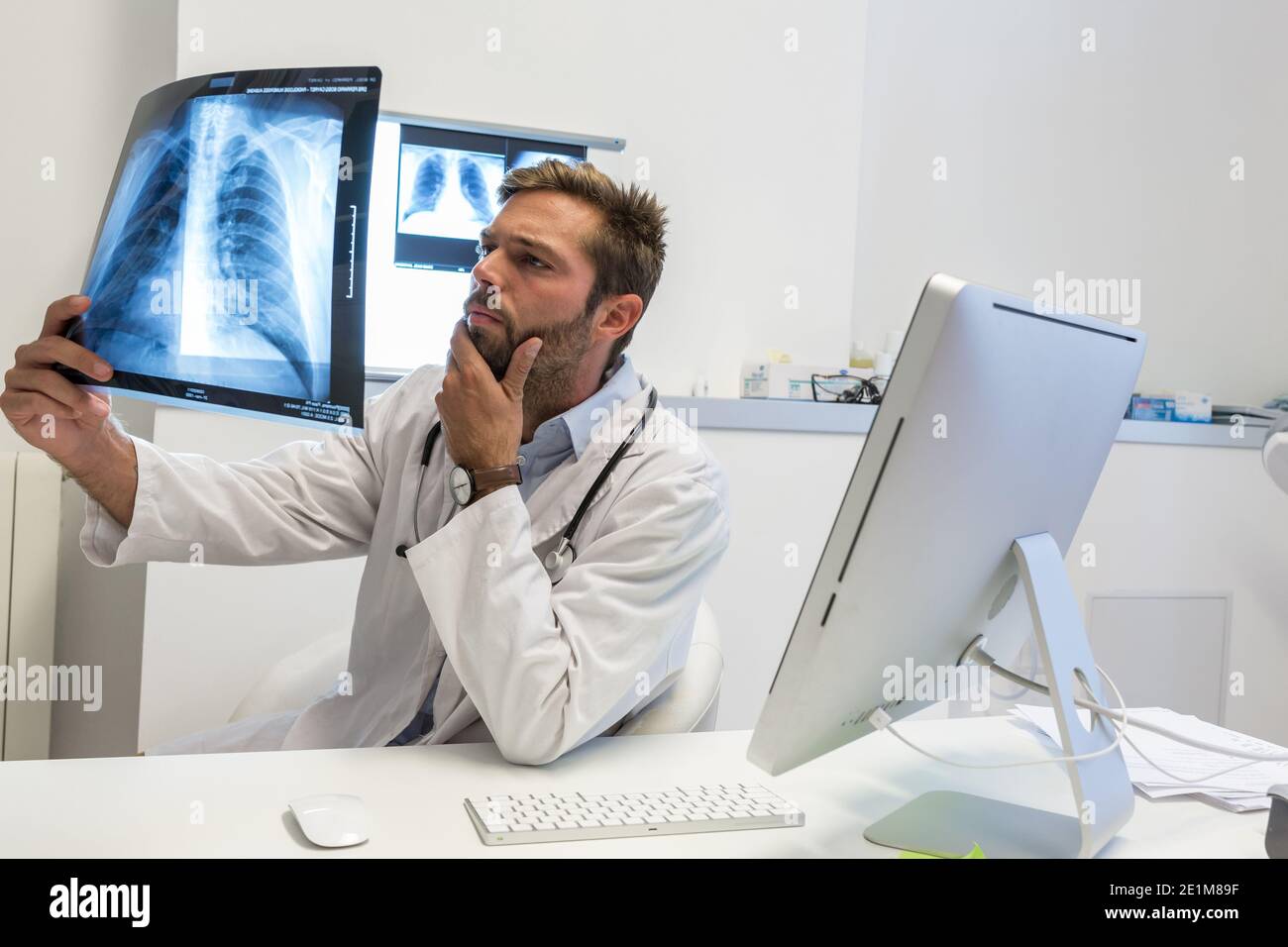 doctor examining an x-ray at hospital Stock Photo - Alamy