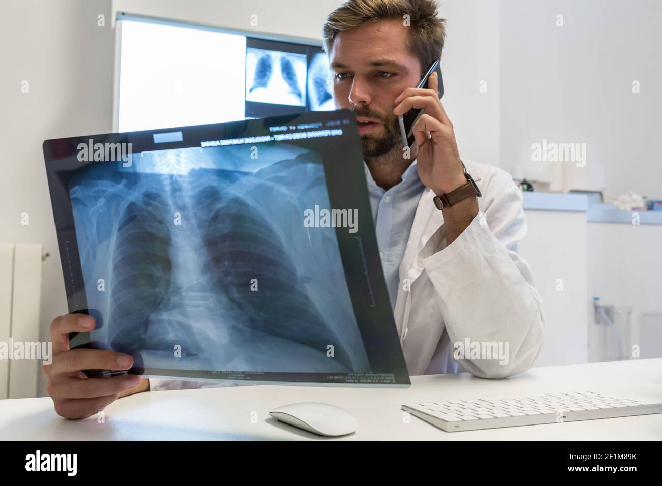 doctor examining an x-ray at hospital Stock Photo - Alamy