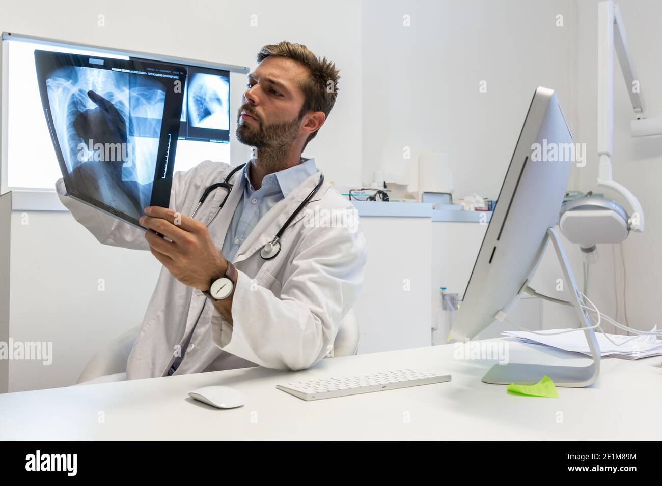 doctor examining an x-ray at hospital Stock Photo - Alamy