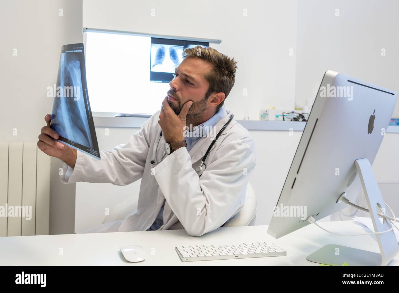 doctor examining an x-ray at hospital Stock Photo - Alamy