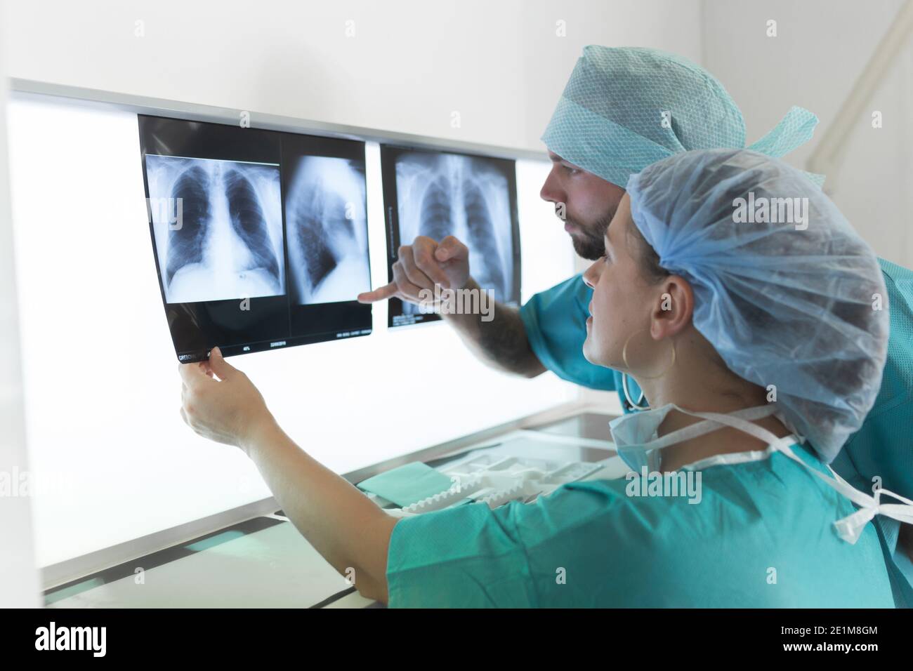 doctor examining an x-ray at hospital Stock Photo - Alamy