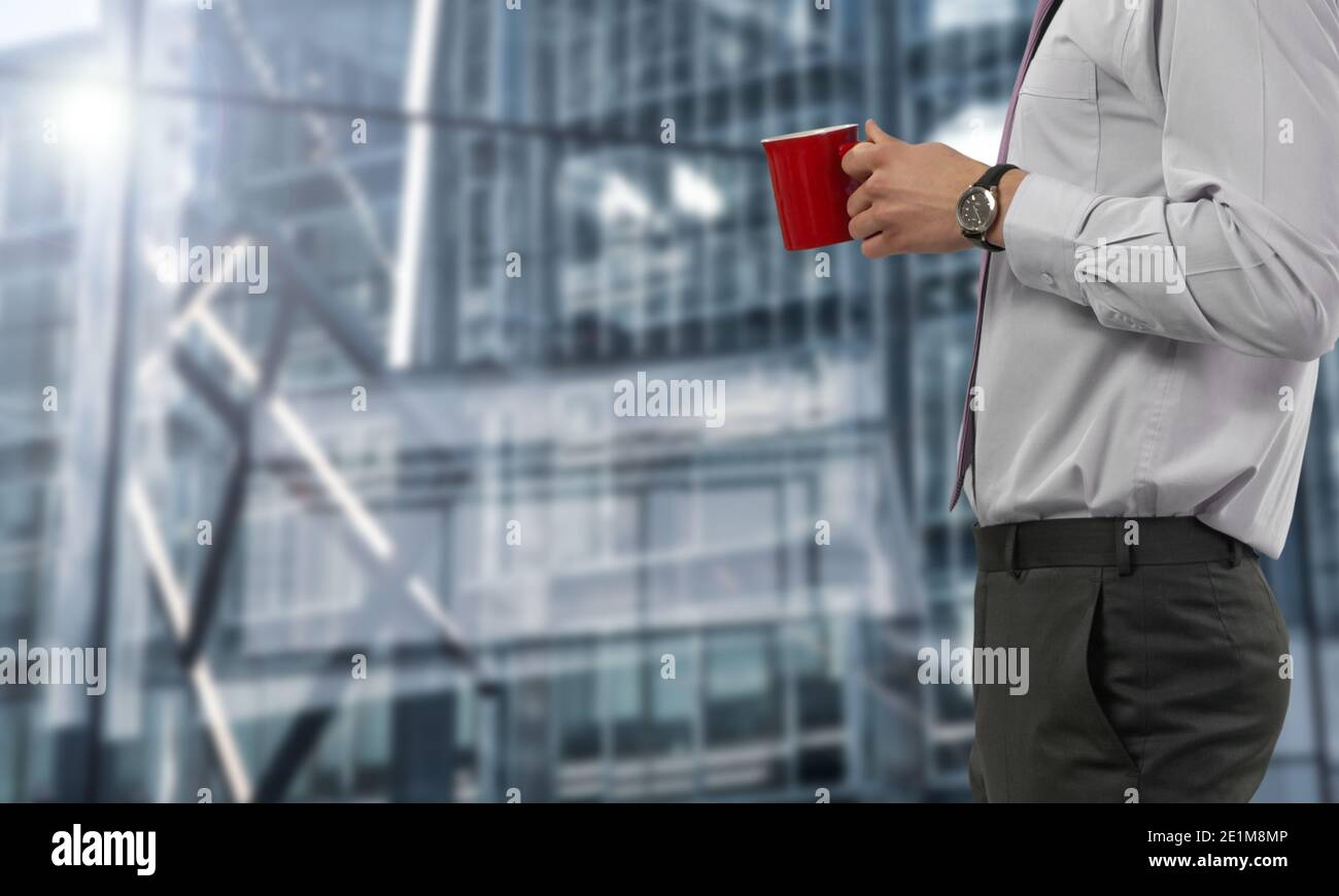 Business man working alone on laptop or with files, in background ...