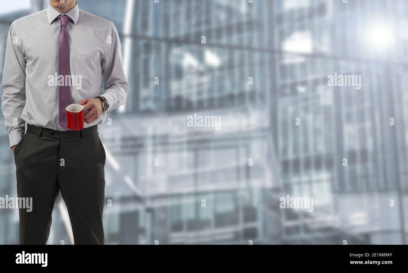 Business man working alone on laptop or with files, in background ...