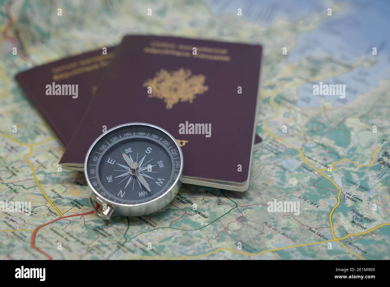compass isolated on a travel map - Travel concept Stock Photo - Alamy