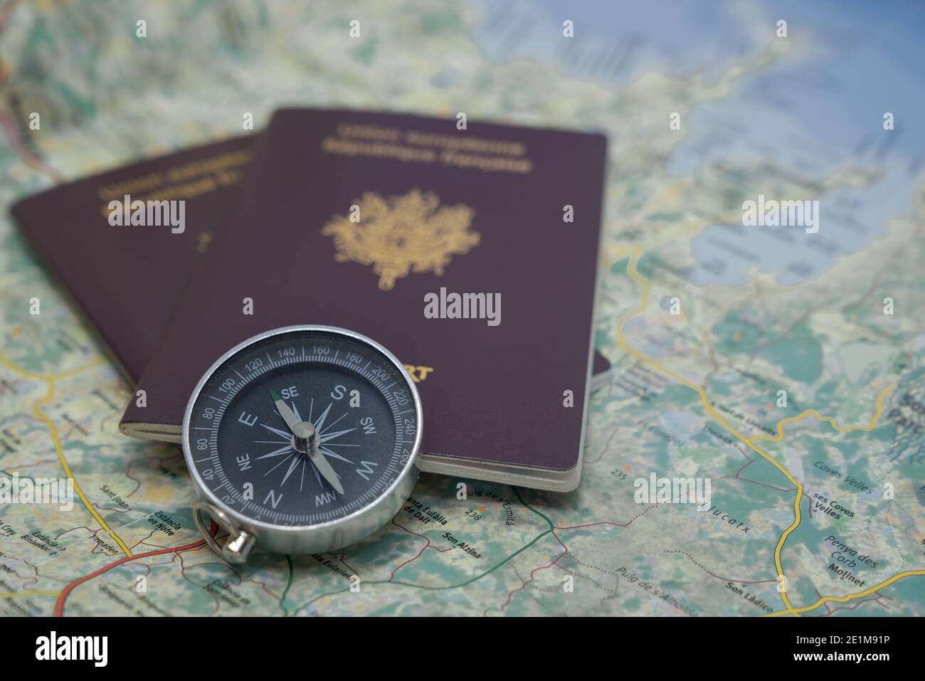 compass isolated on a travel map - Travel concept Stock Photo - Alamy