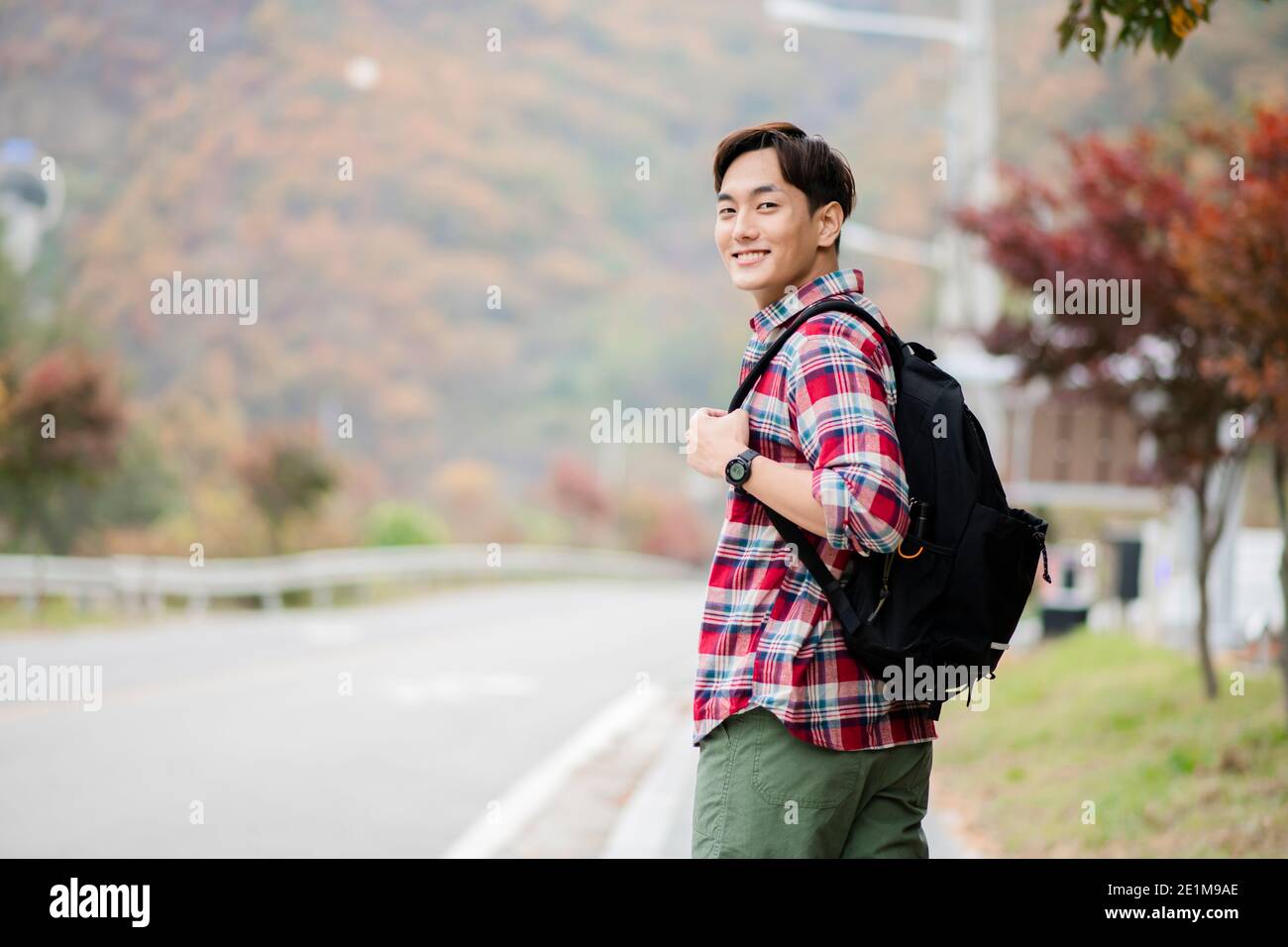 handsome Asian male model autumn travel concept Stock Photo - Alamy