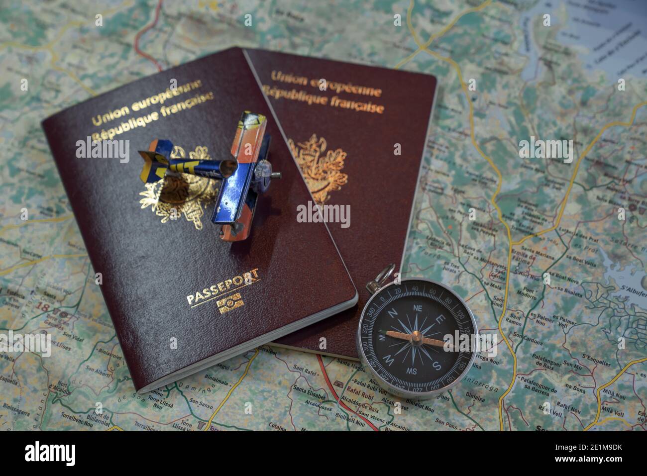 traveling concept with a map, compass, and airplane, symbol of travel ...