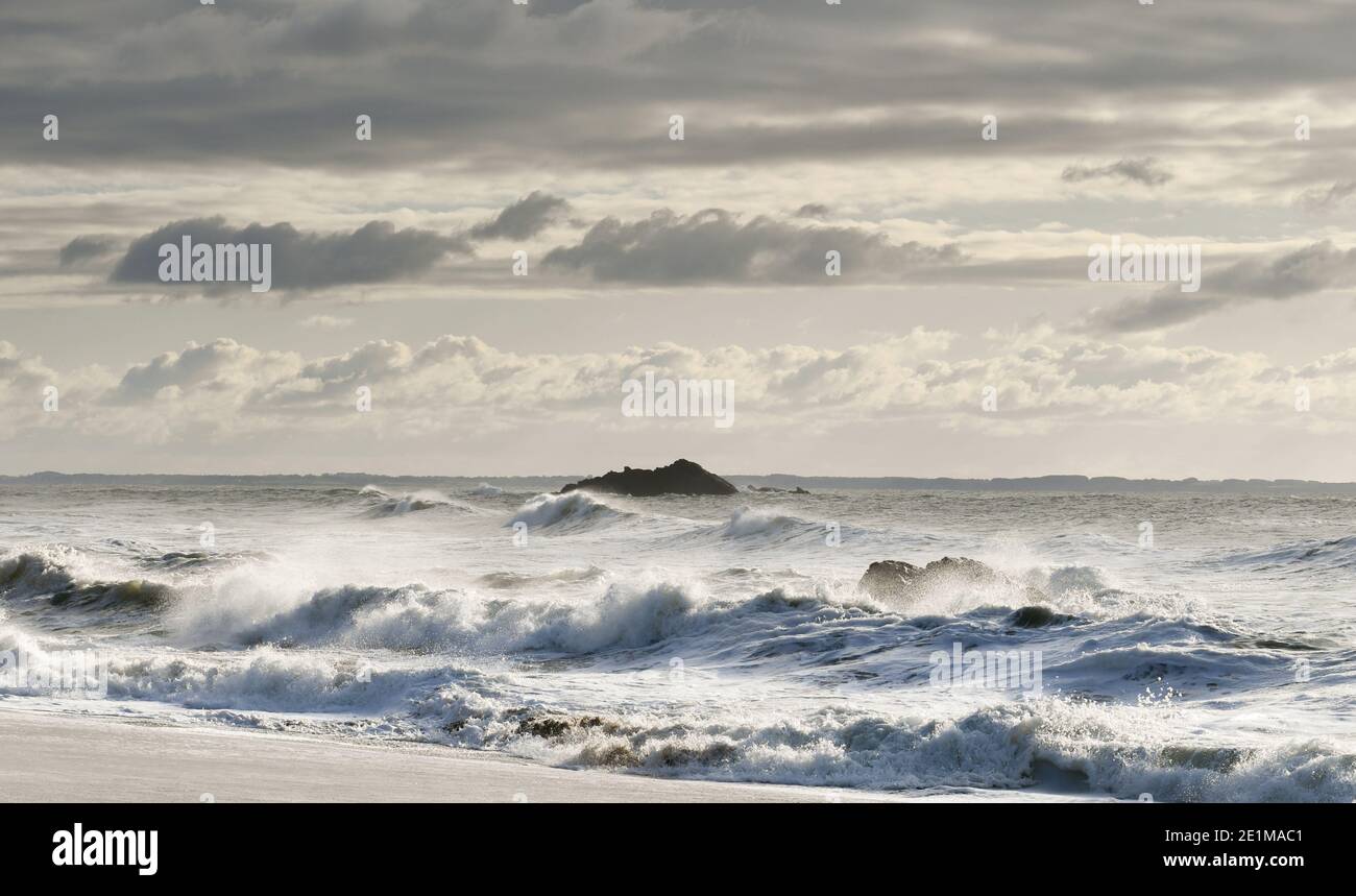 Beautiful golden light on a raging sea Stock Photo - Alamy