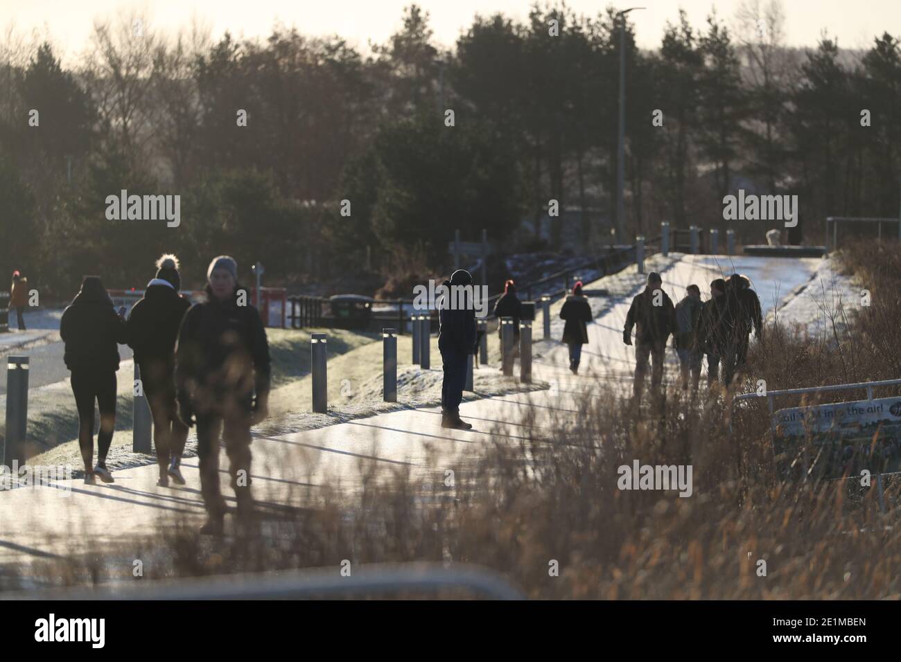 People walk by the frost and snow covered Forth and Clyde Canal near to ...