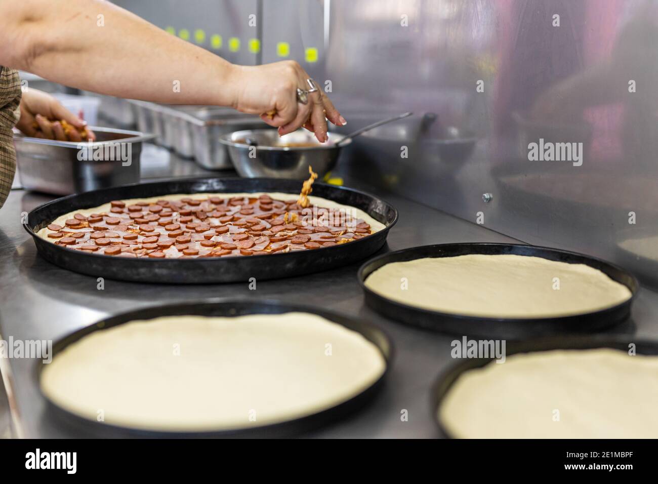 Making of a traditional italian pizza in the kitchen Stock Photo - Alamy