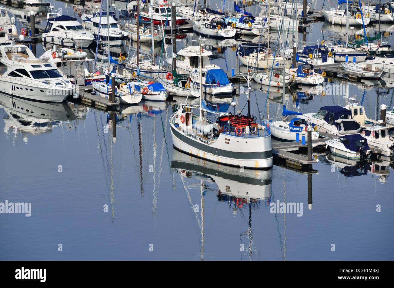 colorful boats in the harbor with reflection Stock Photo - Alamy