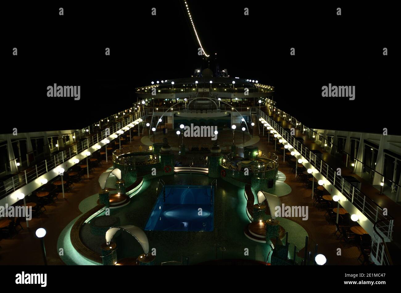 large cruise ship at night with bright lighting Stock Photo - Alamy