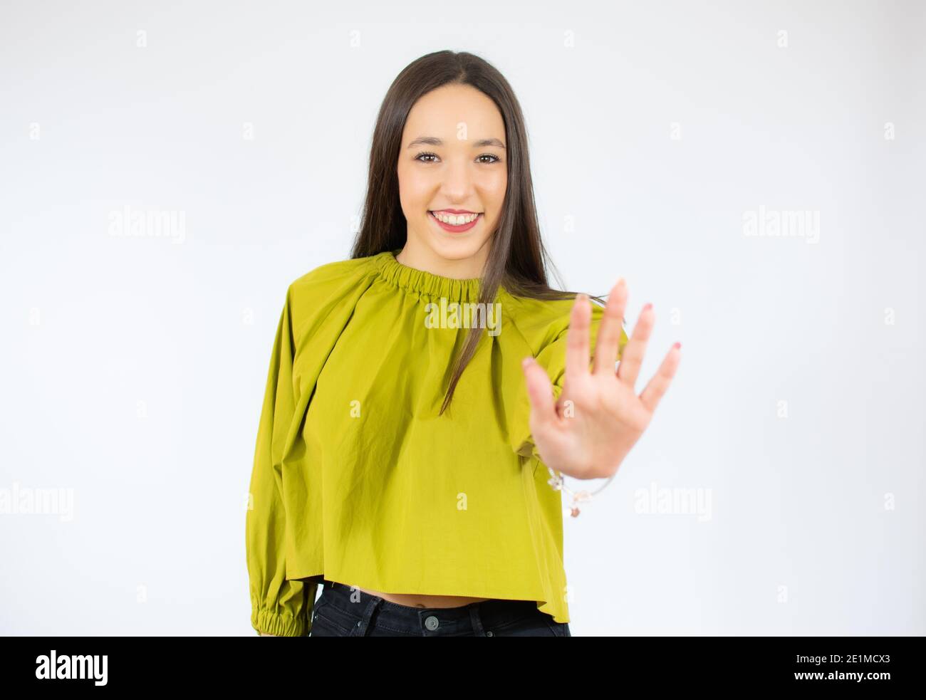Young girl making stop sign over white background Stock Photo - Alamy Young girl making stop sign over white background Stock Photo - Alamy