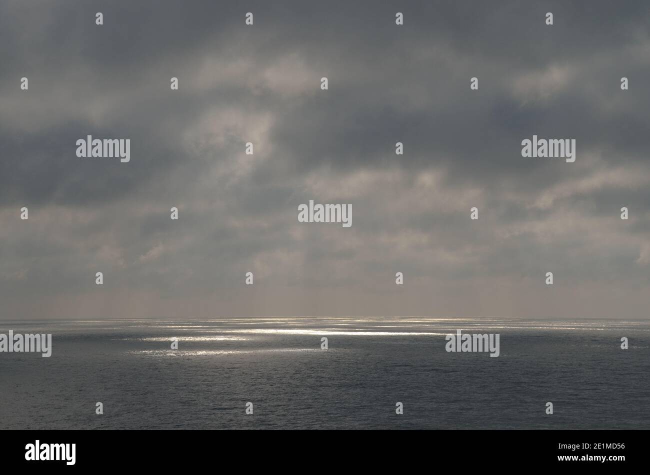gray sea with bright shining spots Stock Photo - Alamy