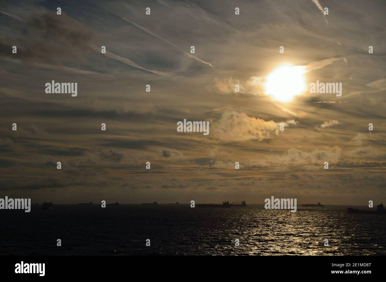 beautiful bright sunset with many ships at sea Stock Photo - Alamy