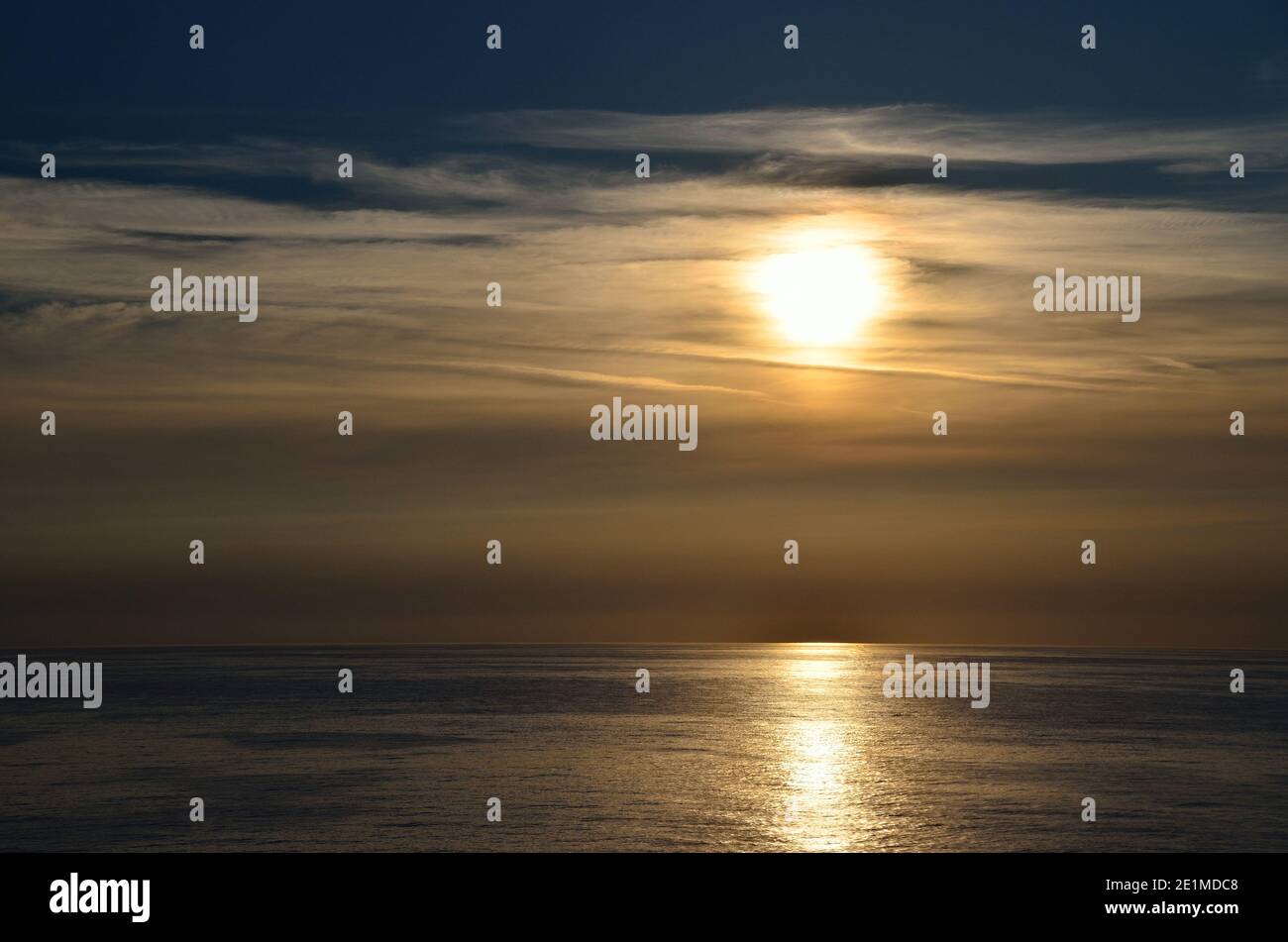 sun and reflection in sea with far horizon Stock Photo - Alamy