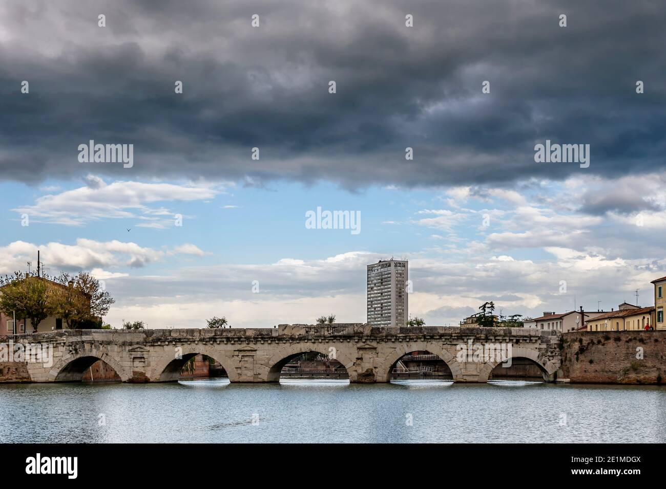 The ancient Bridge of Augustus and Tiberius is reflected in the water ...