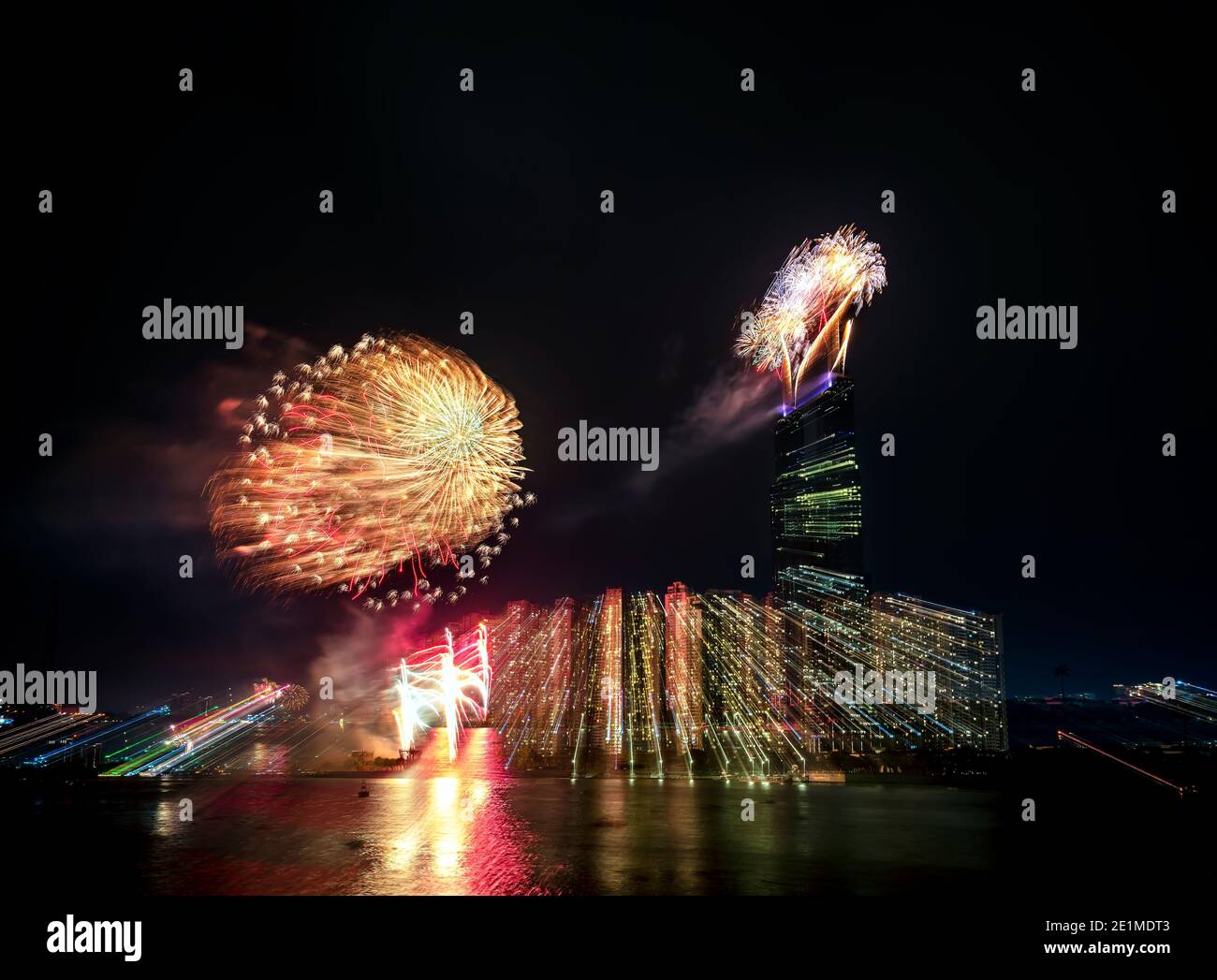 Colorful abstract fireworks next to the skyscraper architecture ...
