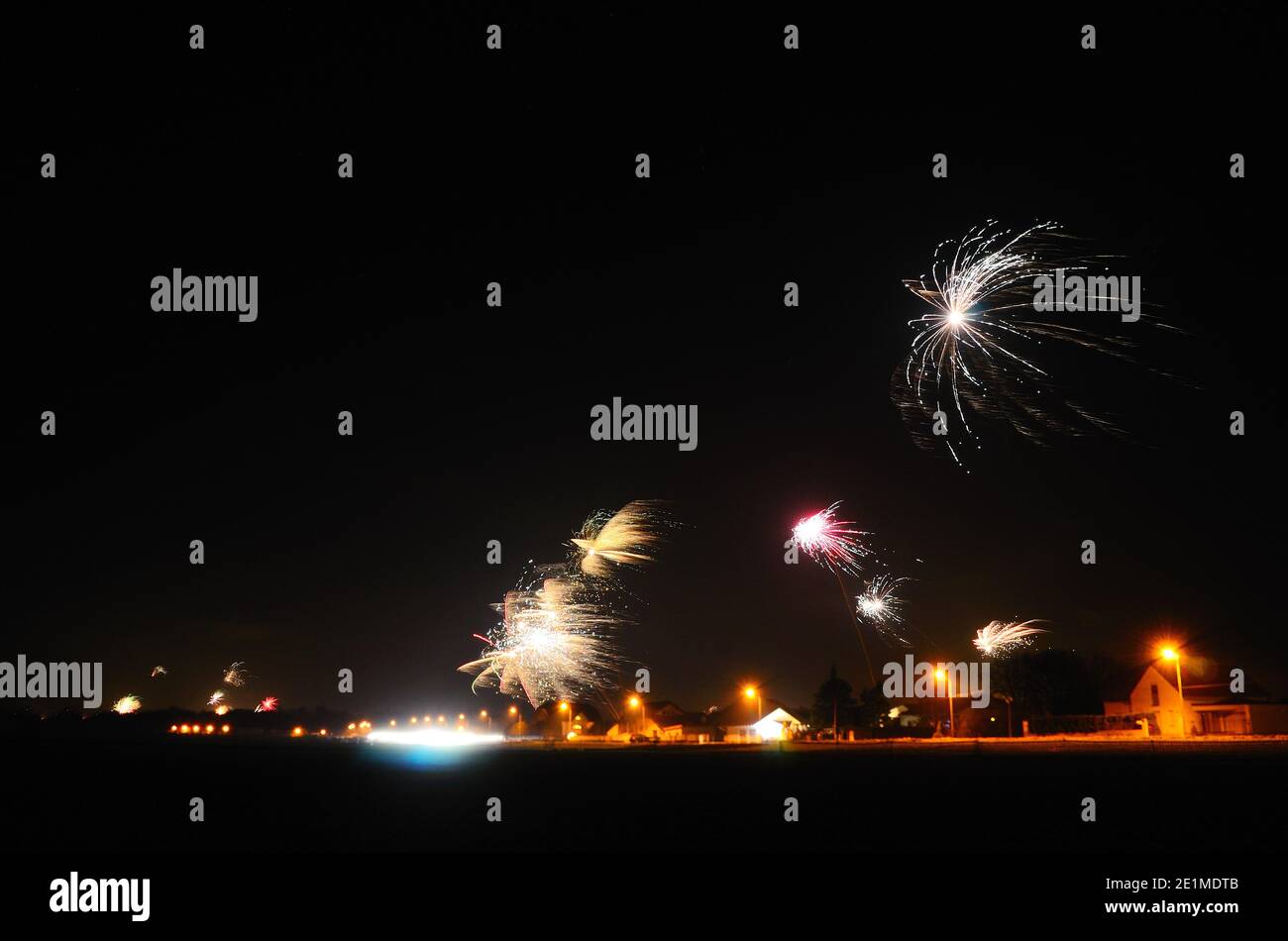 different light rocket explosions at a fireworks Stock Photo - Alamy