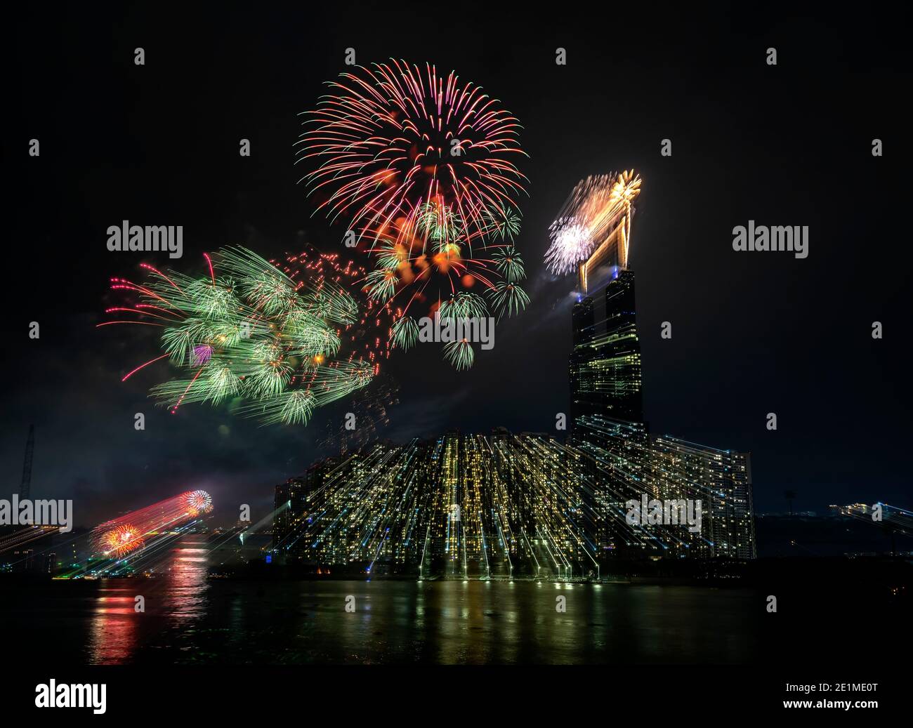 Colorful abstract fireworks next to the skyscraper architecture ...