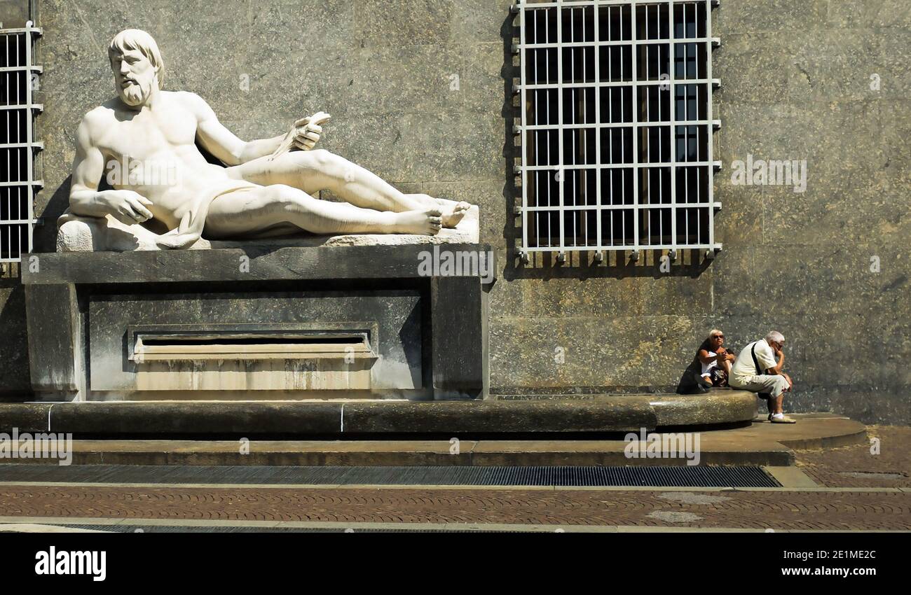 Couple sat next to Fountain of the River Po Statue in Piazza CLN behind ...