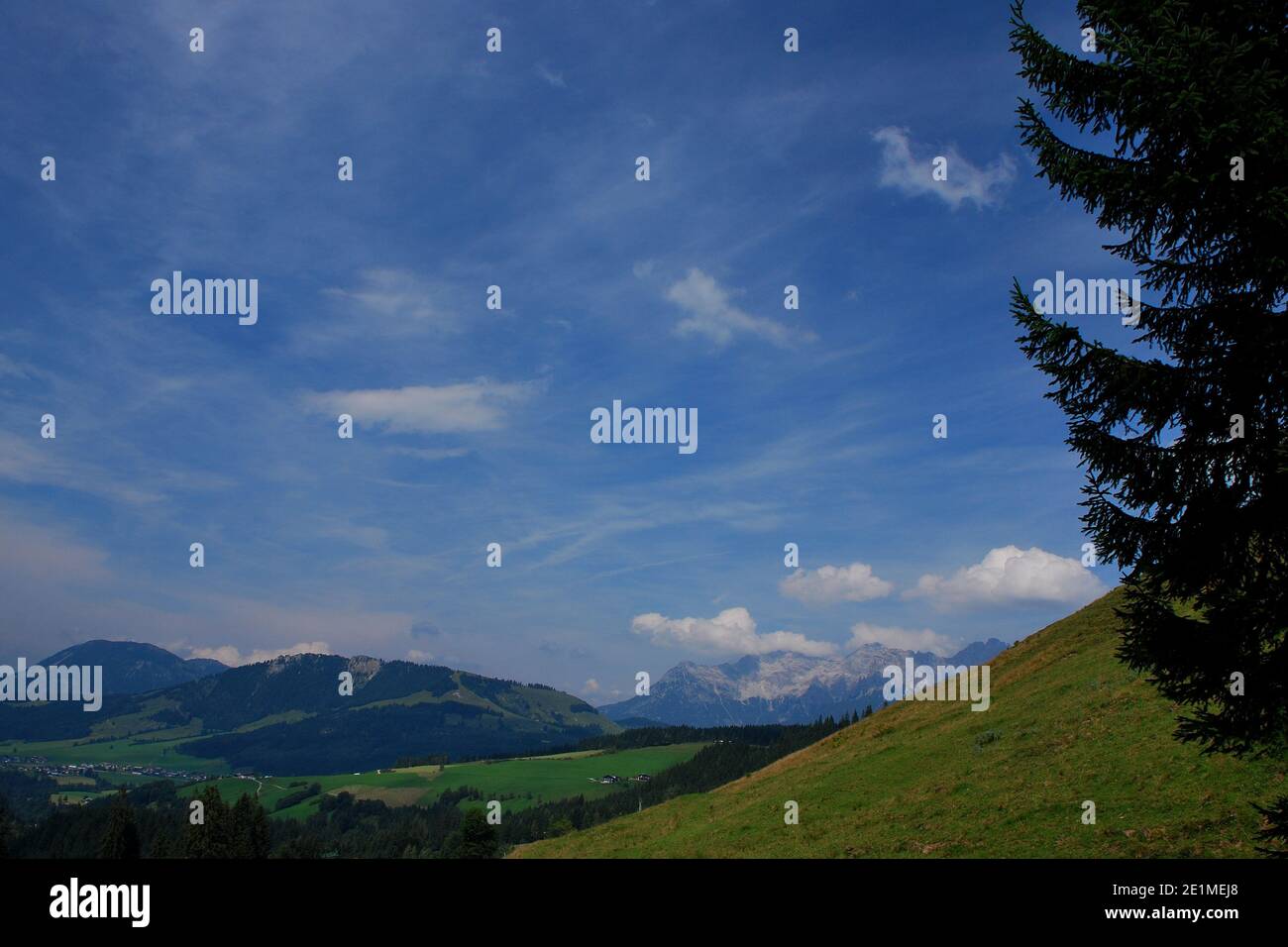 beautiful mountains and green fields on the horizon Stock Photo - Alamy