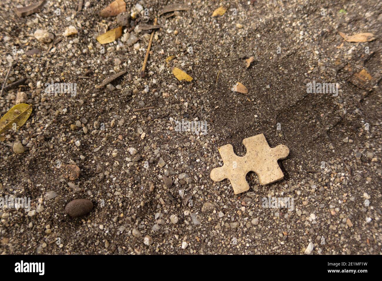 A top view of a piece of a puzzle on the ground Stock Photo - Alamy