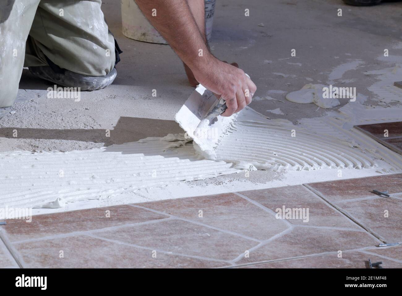 Tiler worker during his work Stock Photo - Alamy