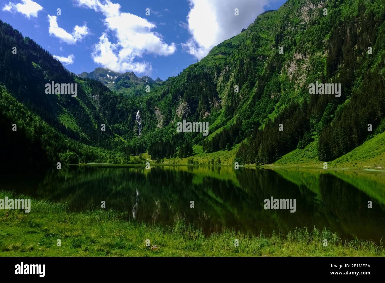 green landscape with mountain lake waterfall and mountains on vacation ...