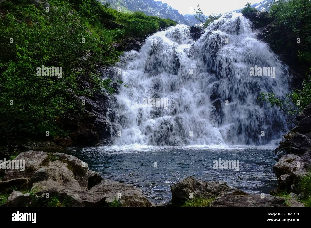 gorgeous wide waterfall with a basin while hiking in the summer Stock ...