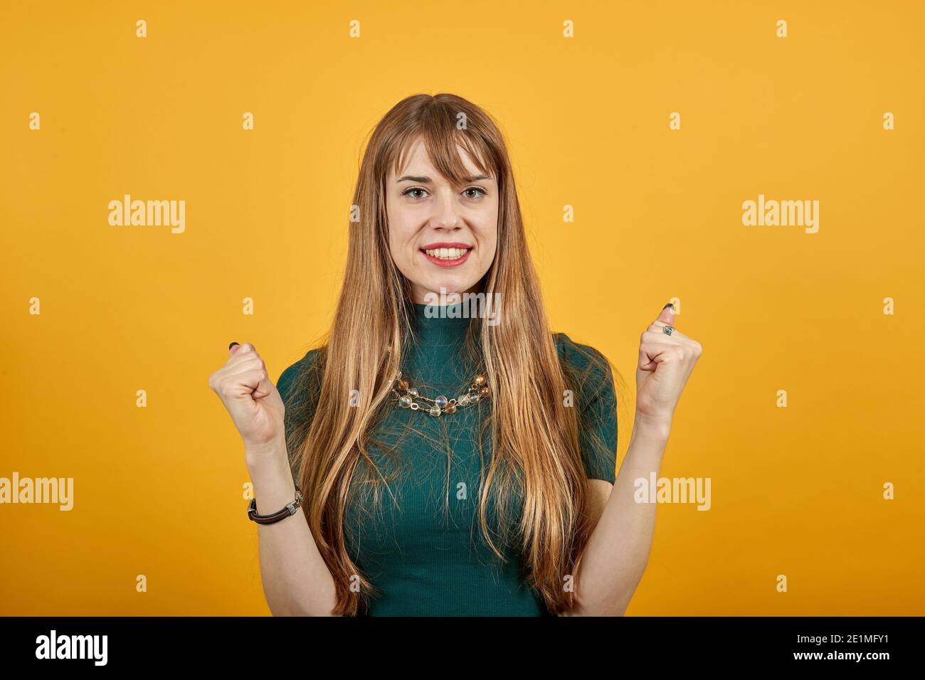Excited young celebrating win, showing yes gesture, rejoicing success ...
