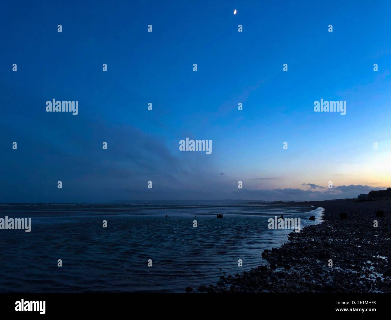 Cold beach evening blue sky night Stock Photo - Alamy