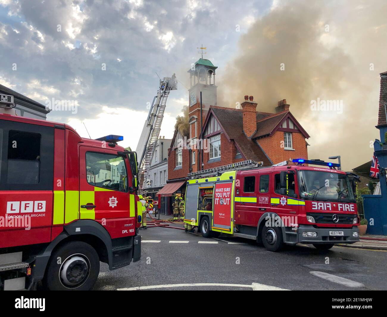 Fire Brigade attended burning building Stock Photo - Alamy