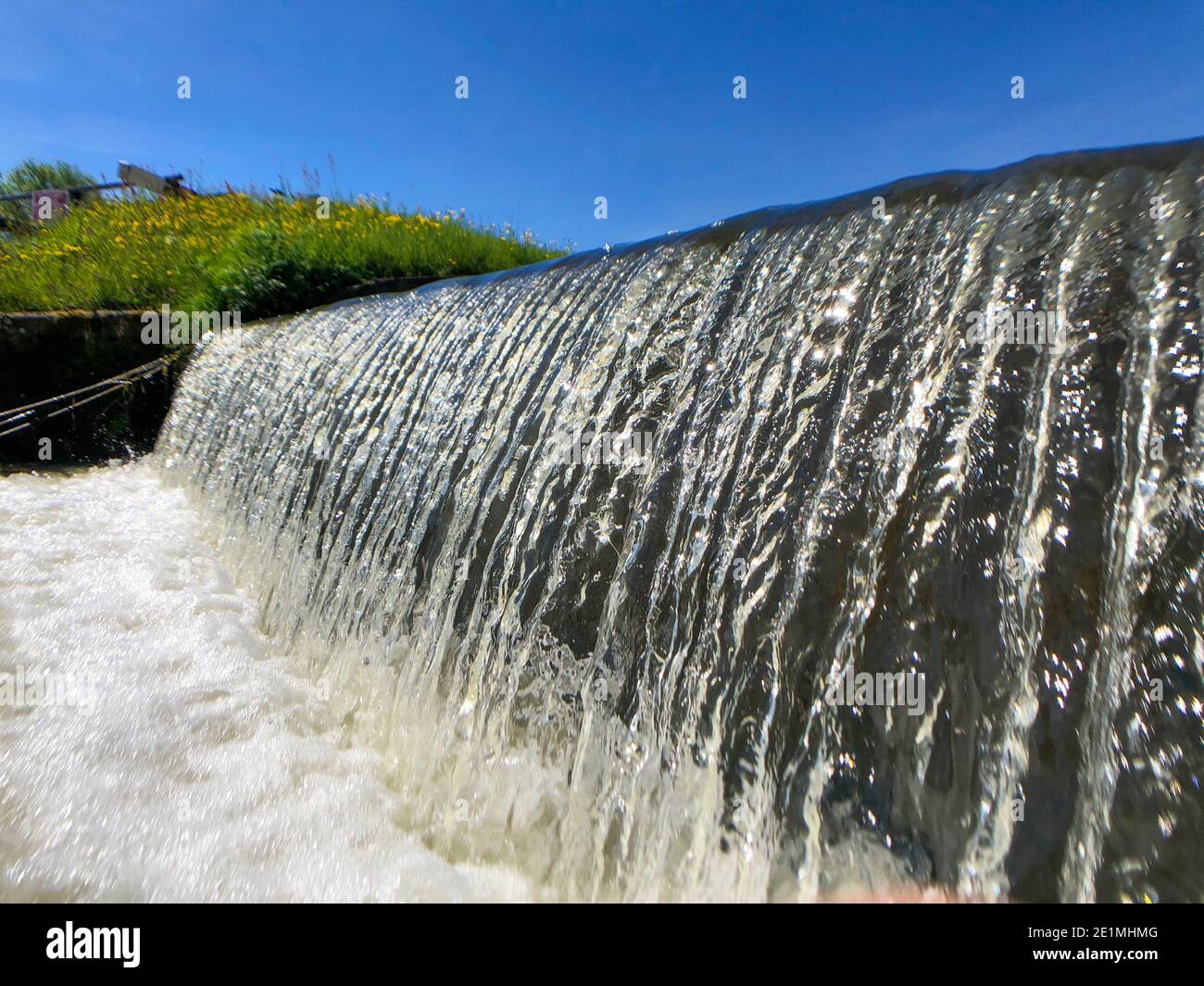 Lock keepers cottage by canal with small water fall blue sky Stock ...