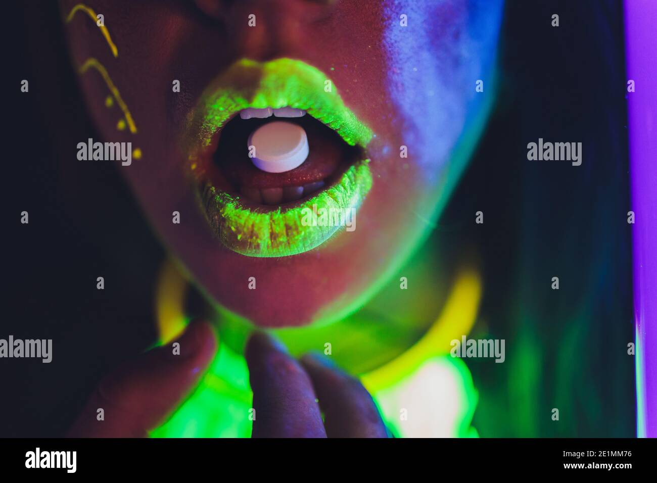 beautiful girl with lsd on tongue in nightclub with pink smoke Stock ...