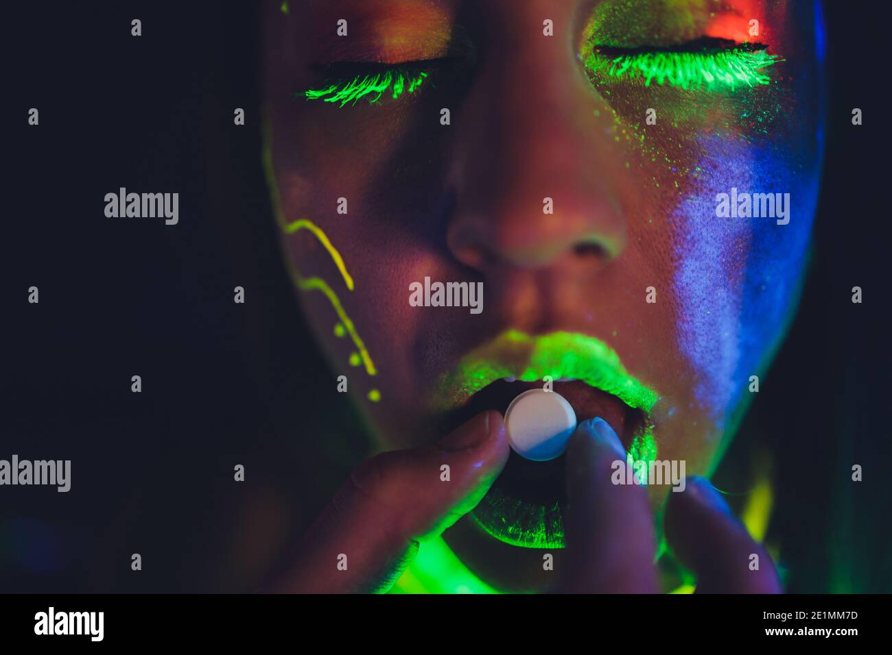 beautiful girl with lsd on tongue in nightclub with pink smoke Stock ...