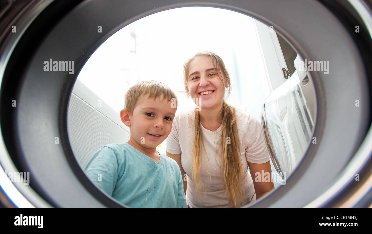 Son helping mother laundry hi-res stock photography and images - Alamy