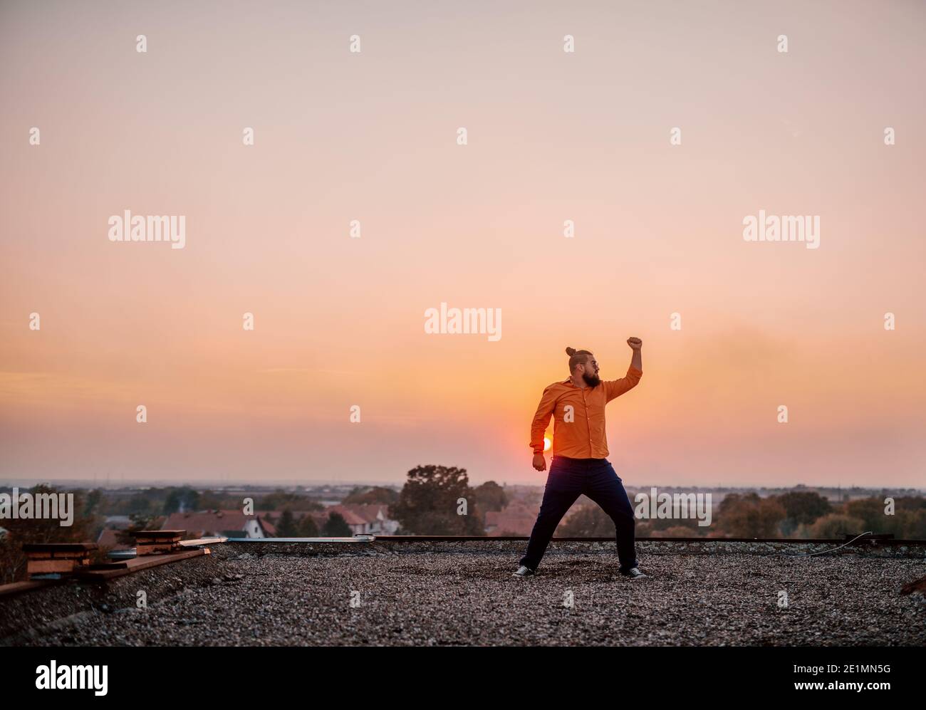 Business man standing on rooftop hi-res stock photography and images ...