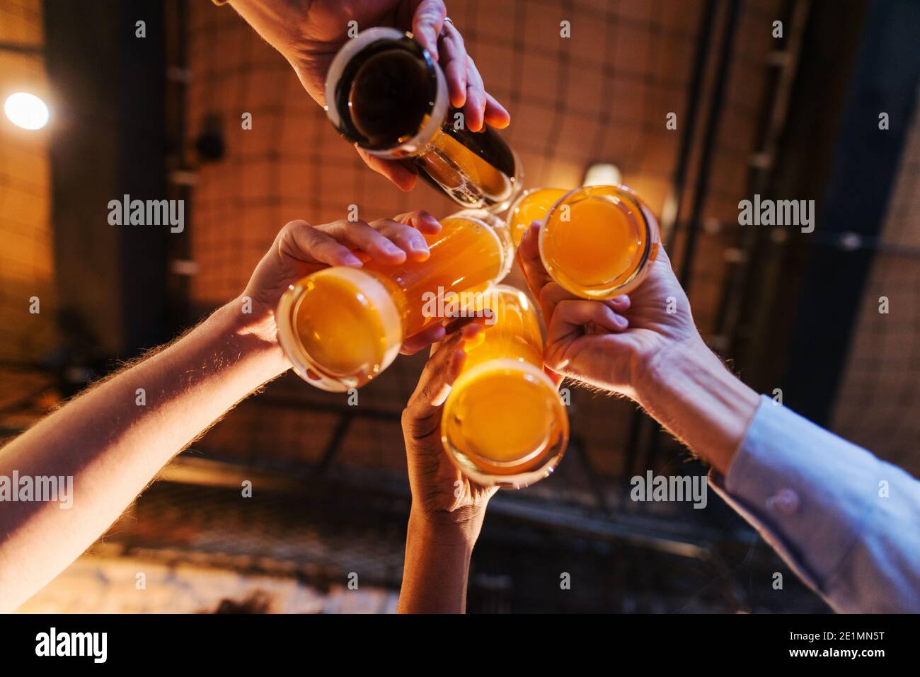 Person making a toast to group hi-res stock photography and images - Alamy