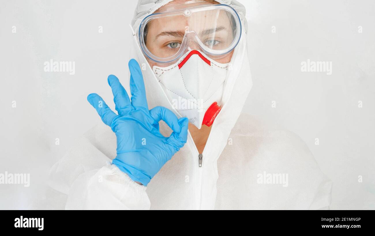 Portrait of medical worker or doctor protecting with suit and mask from ...