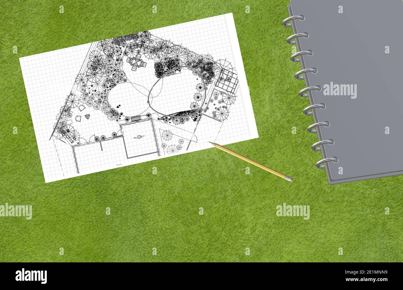 Landscape garden sketch with pencil, notepad on a green lawn background ...