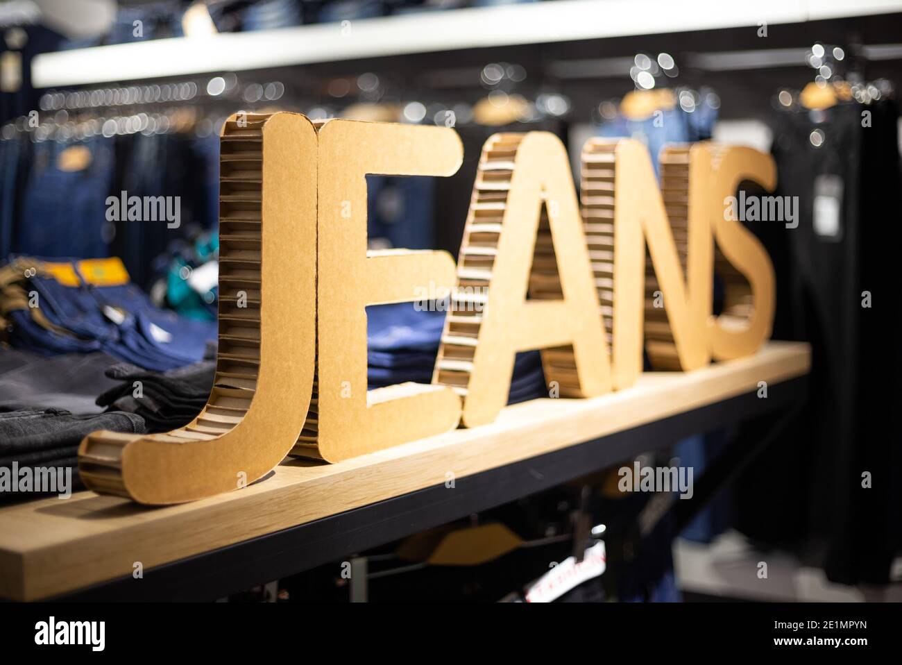 Cardboard lettering jeans in a shop. Concept of buy, sell, shopping and ...