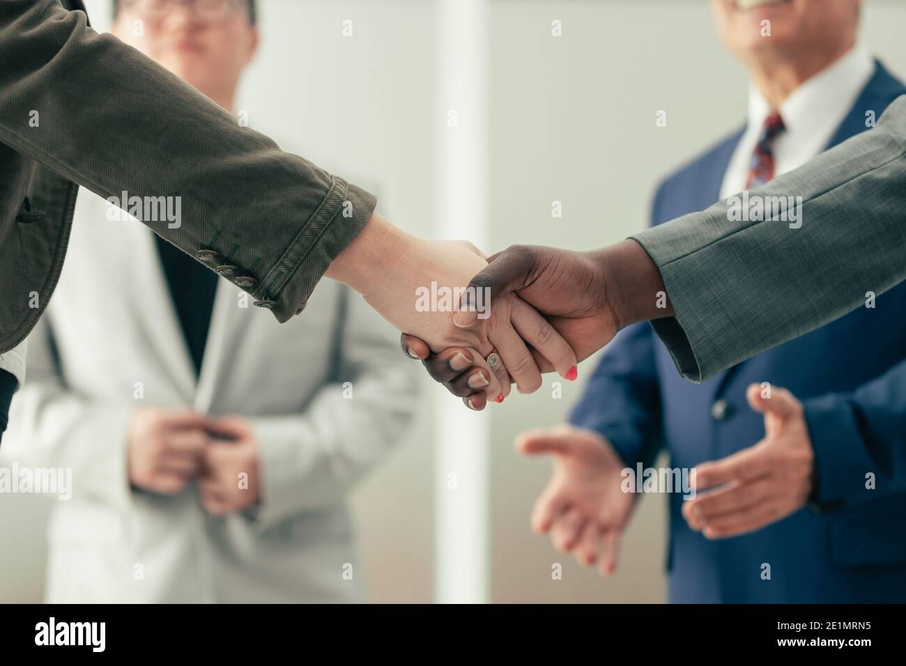 close up. international business partners shaking hands Stock Photo - Alamy
