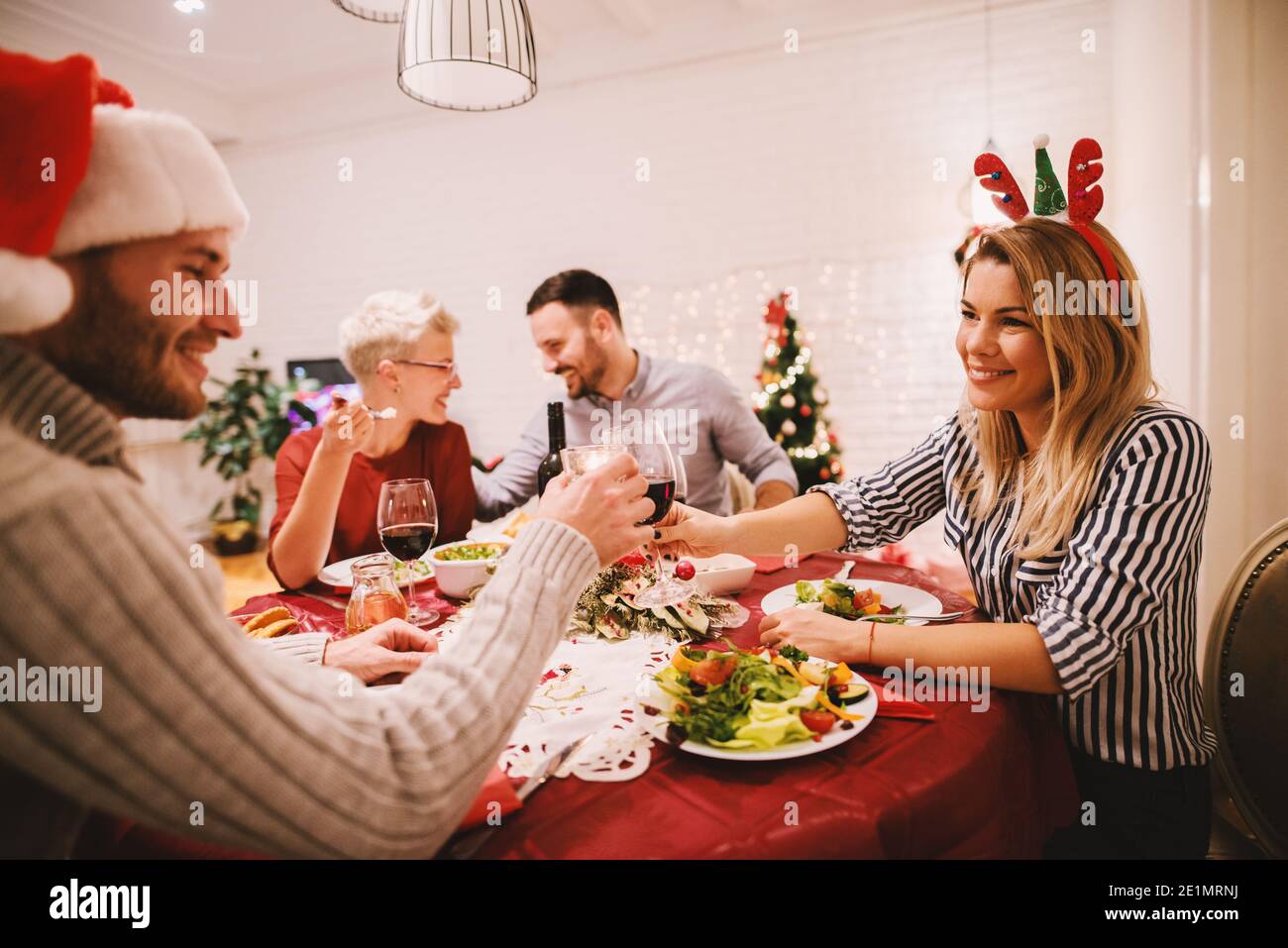 Happy family christmas eve. Christmas friends Stock Photo - Alamy