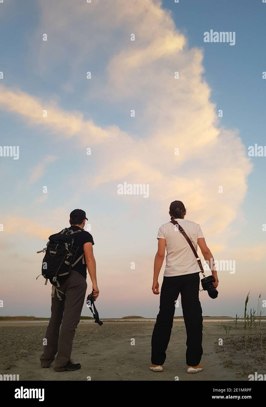 Two photographers for a walk. They are looking for a plot Stock Photo ...