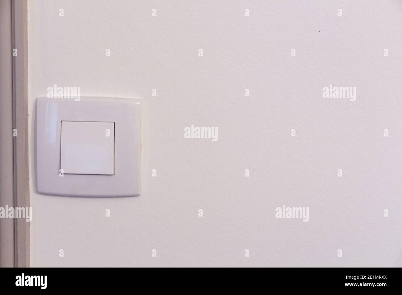 White switch made in plastic in a wall Stock Photo - Alamy