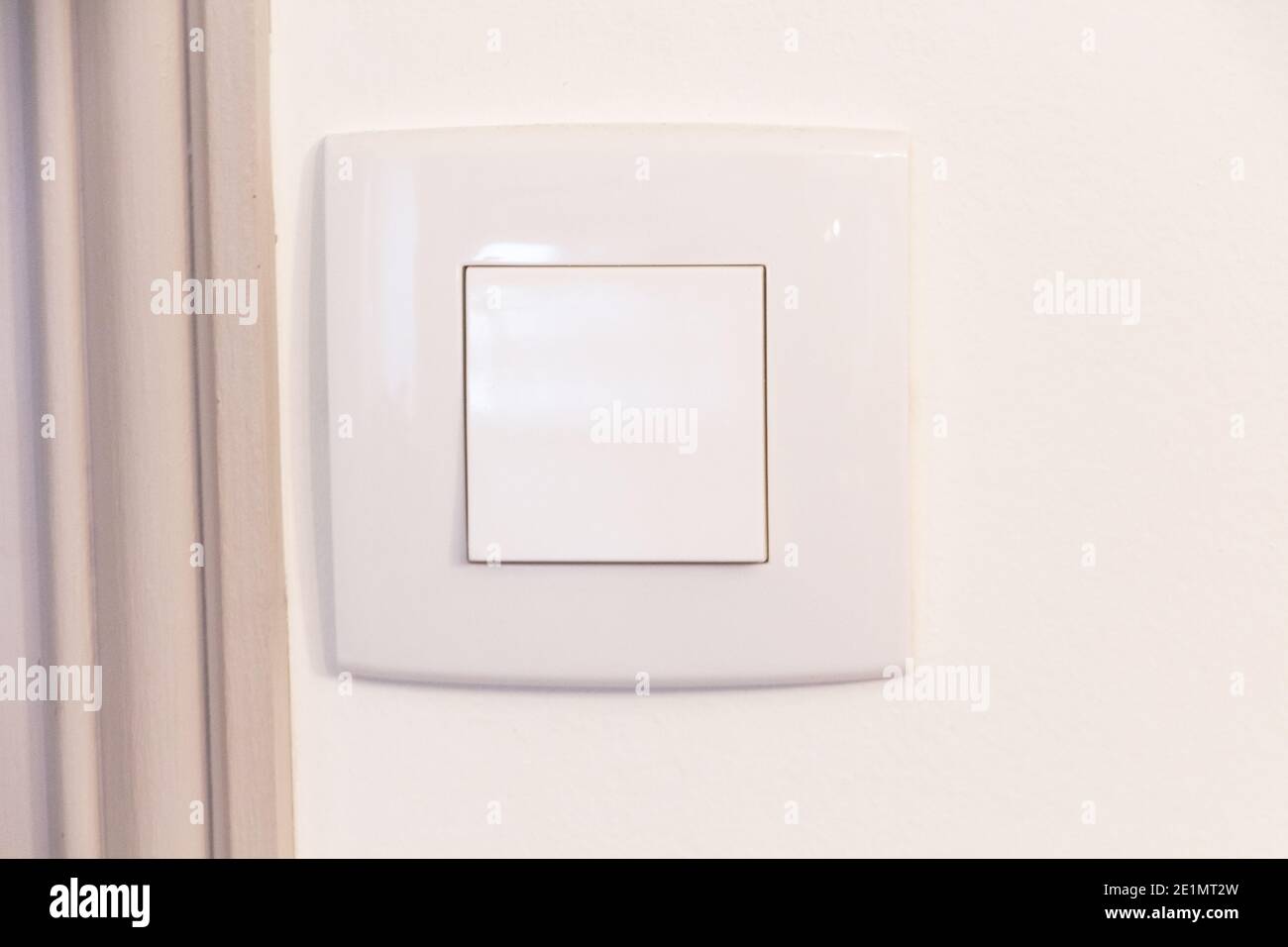 Switch in a wall to turn on or off the light Stock Photo - Alamy